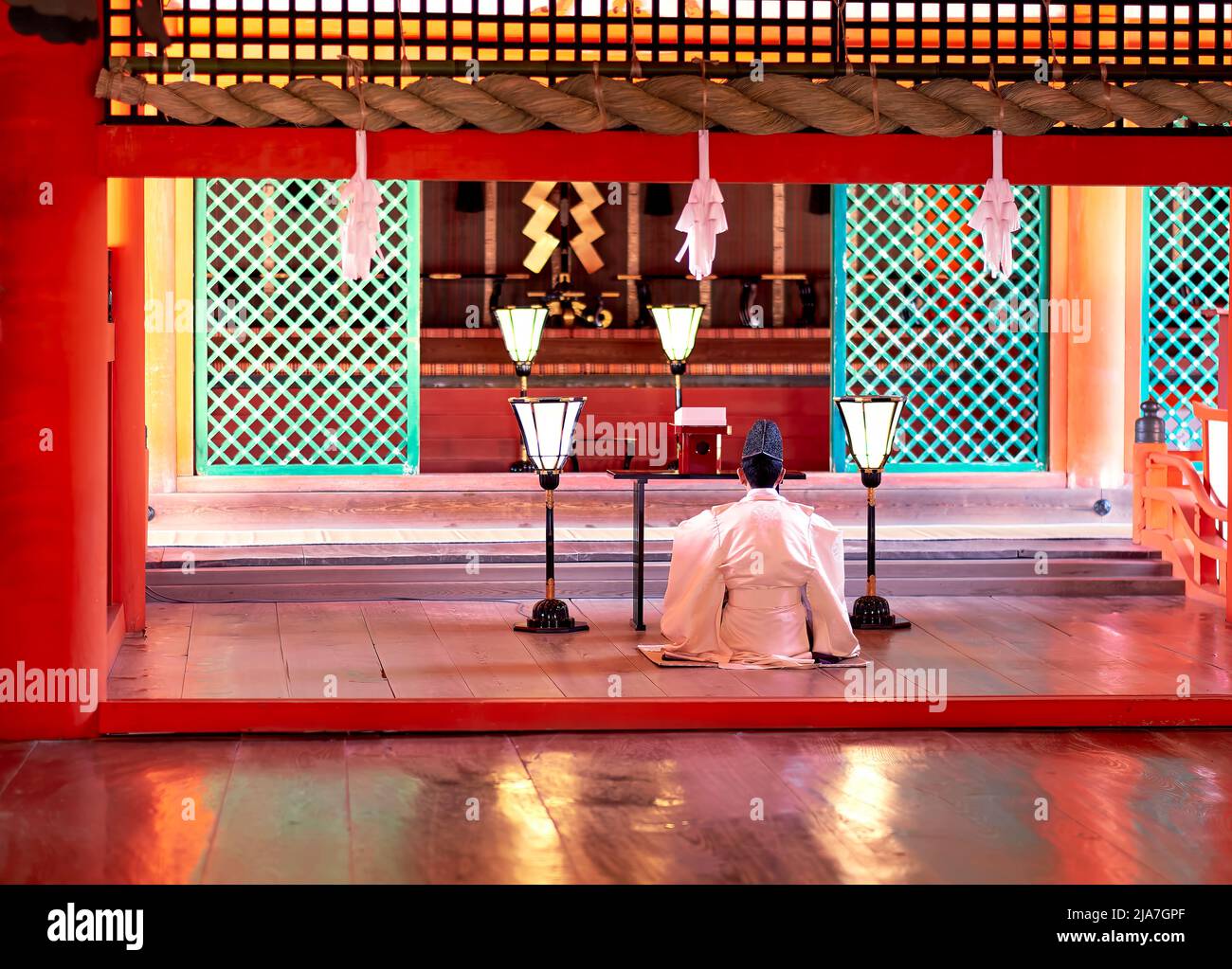 Japan. Miyajima. Hiroshima. Itsukushima shrine. A buddhist monk praying ...