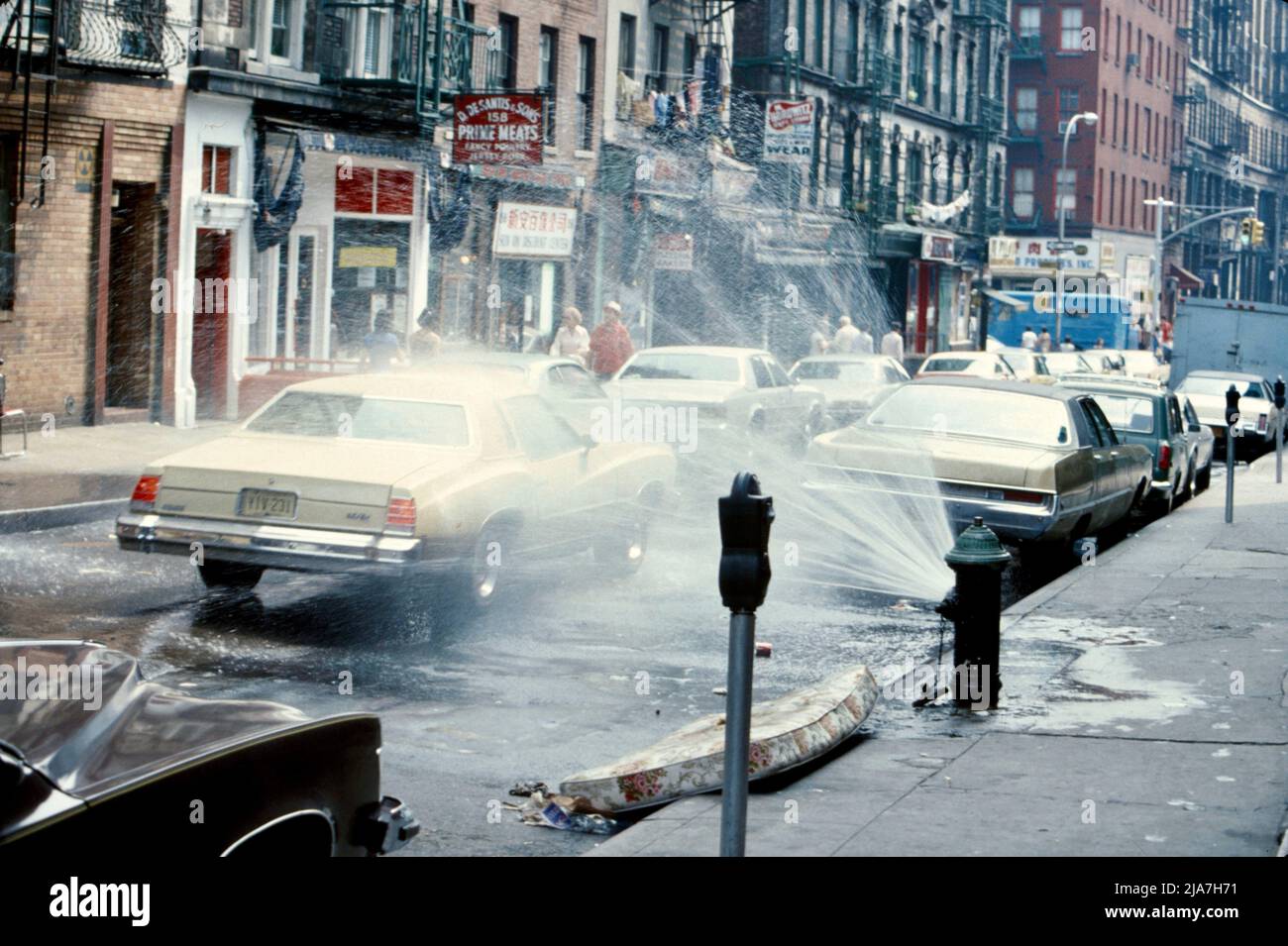 Opened fire hydrant and old parking meters in downtown New York City ...