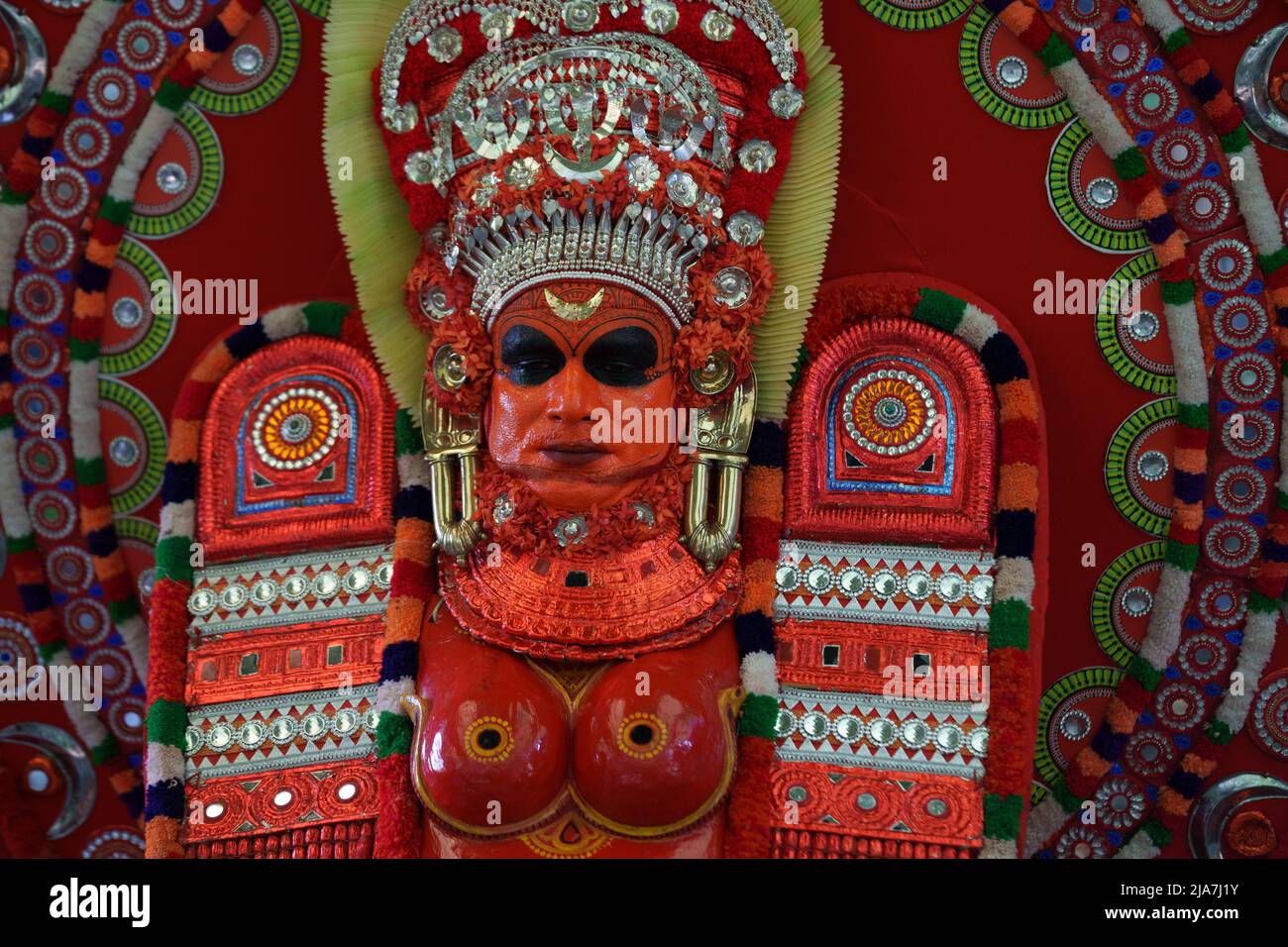 Theyyam is a famous ritual art form in kerala with face painted using ...