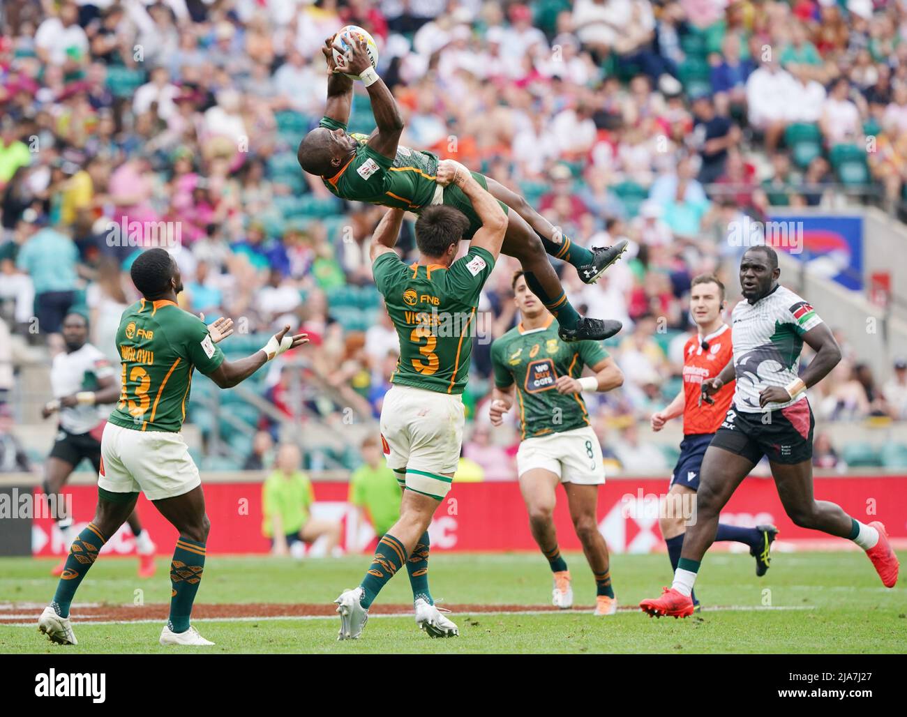 Kenya's Bush Mwale (right) watches as South Africa's Impi Visser ...