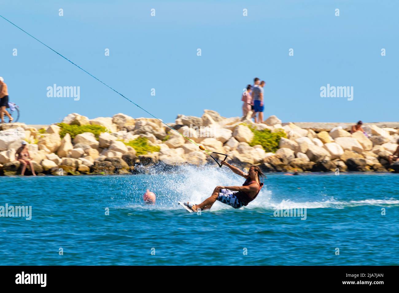 Active wakesurfer jumping on wake board at Varna beach,Bulgaria.Active ...