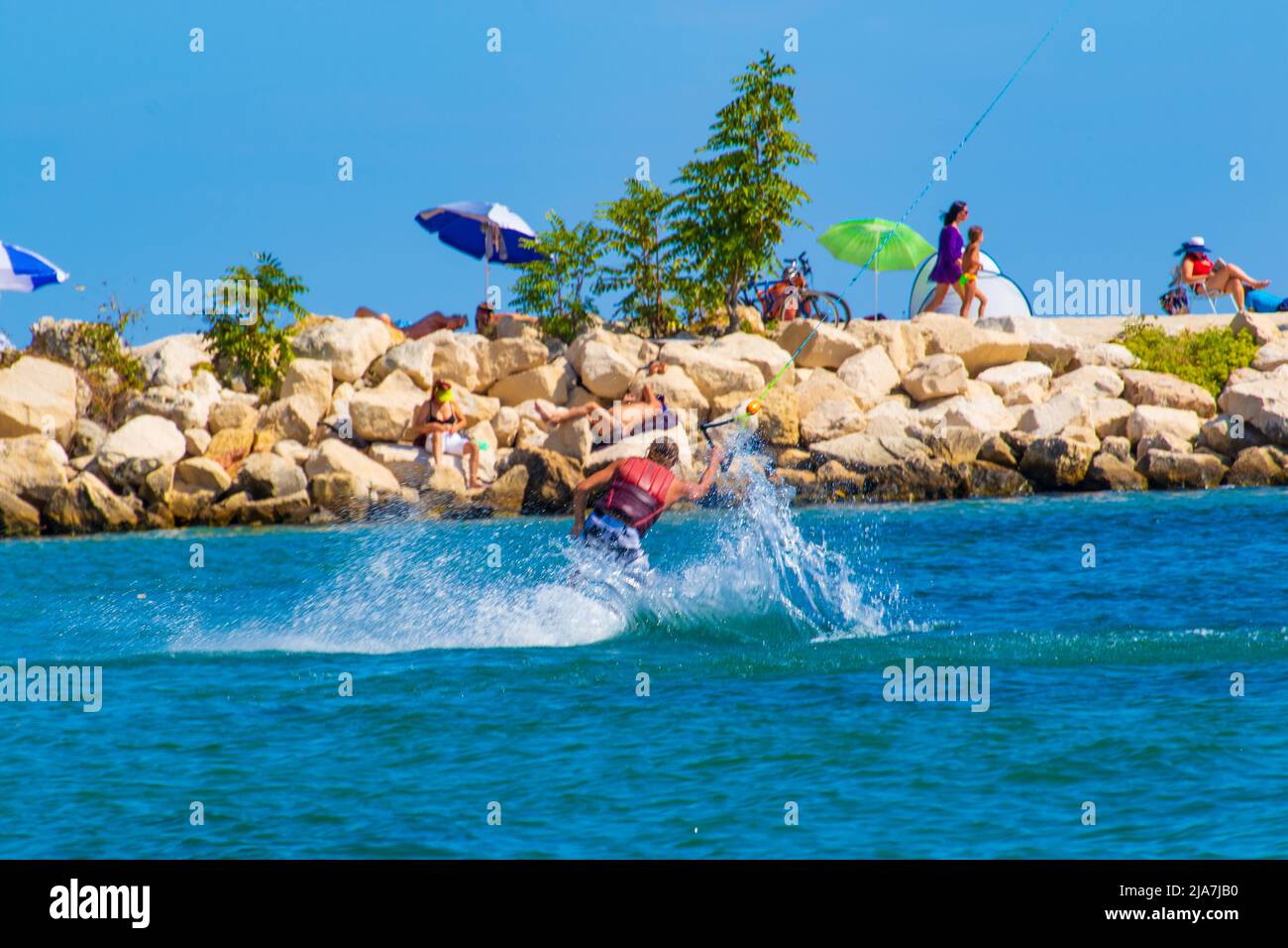 Active wakesurfer jumping on wake board at Varna beach,Bulgaria.Active ...