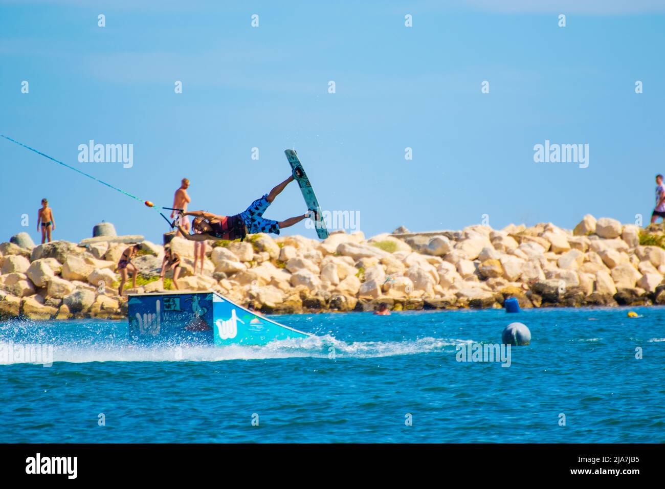 Active wakesurfer jumping on wake board at Varna beach,Bulgaria.Active ...