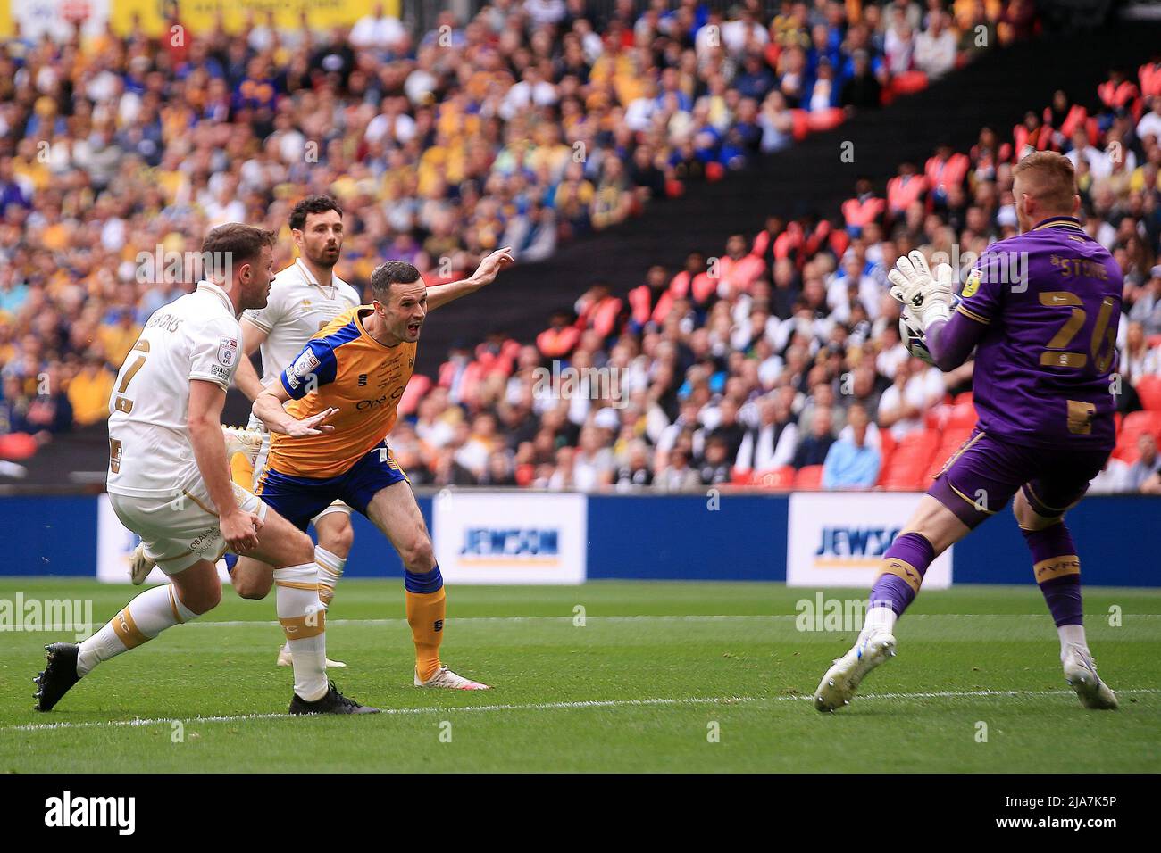 London, UK. 28th May, 2022. Jamie Murphy of Mansfield Town's (2L) has a ...