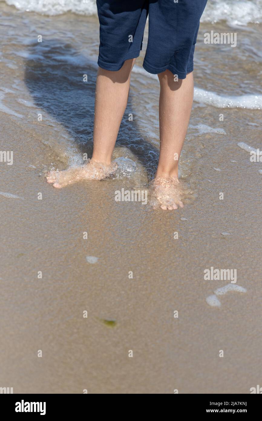 Legs and feet of little boy hi-res stock photography and images - Alamy