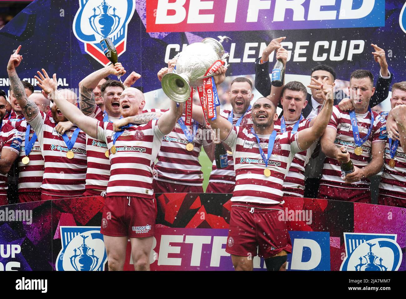 Wigan Warriors' Liam Farrell and Thomas Leuluai lift the trophy ...