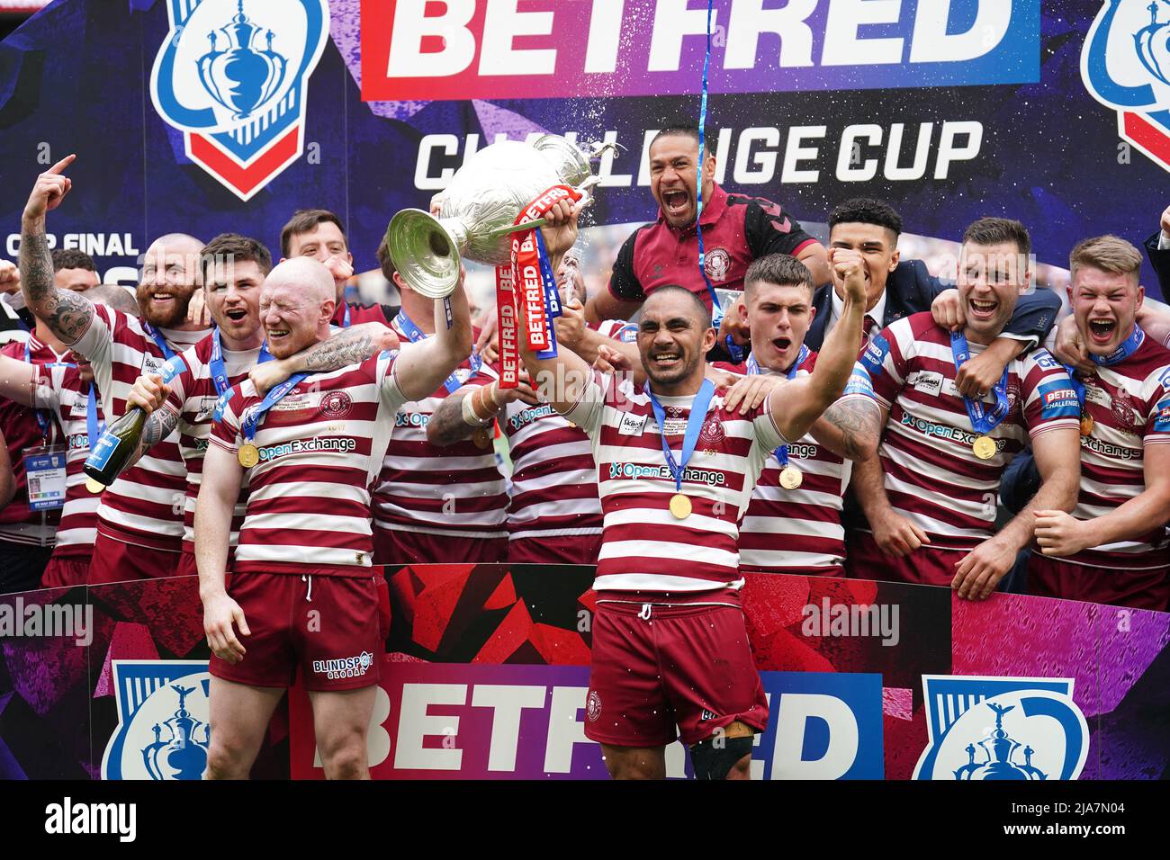 Wigan Warriors' Liam Farrell and Thomas Leuluai lift the trophy ...