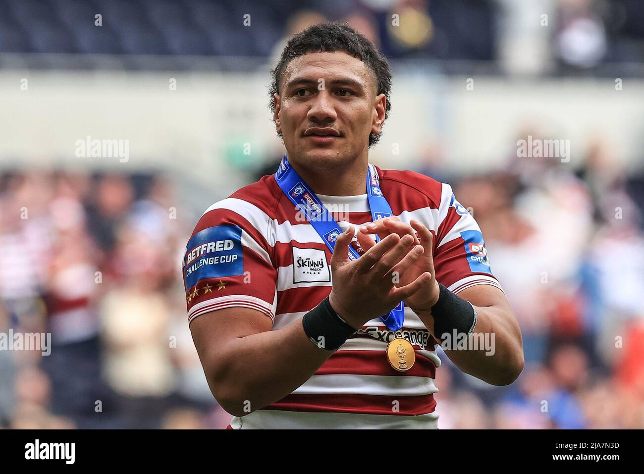 Patrick Mago #10 of Wigan Warriors celebrates with his cup winners ...