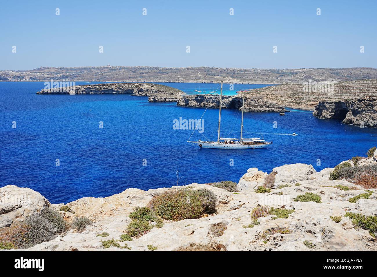 Yacht and blue lagoon on european Comino island in Malta, clear blue ...