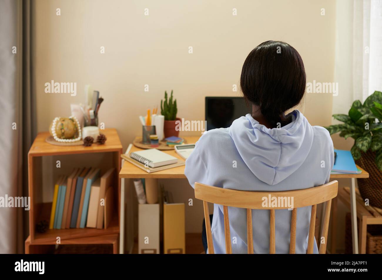 Young college student back home hi-res stock photography and images - Alamy
