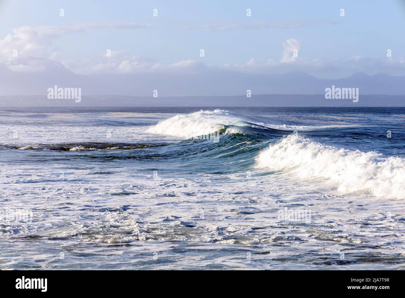 Waves crashing on the rocks at Mossel Bay on the Garden Route of South ...