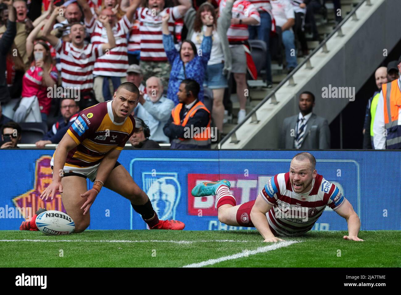 Liam Marshall #5 of Wigan Warriors goes over for the winning try and ...