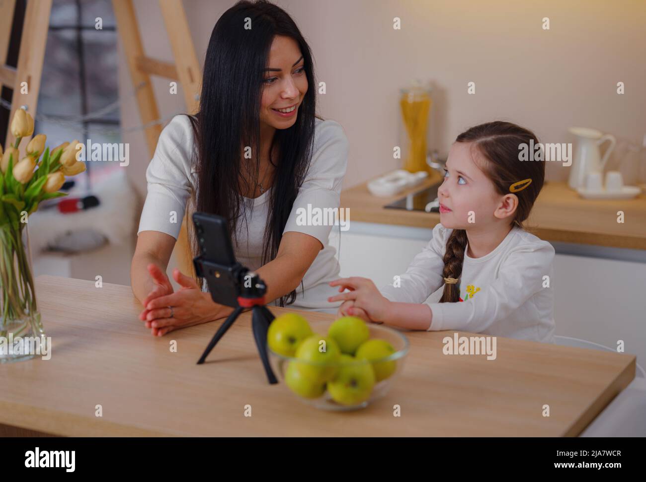 Blogger mom with her baby at home. Millennial Influencer woman creating ...