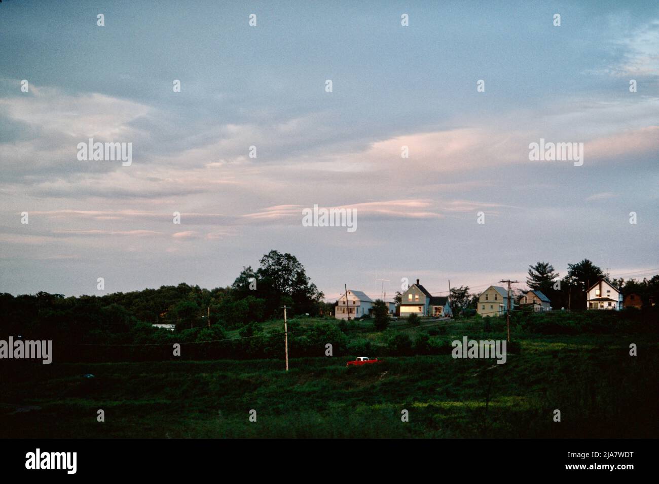 Distant houses on hill in northern New York State, USA in 1979 Stock ...