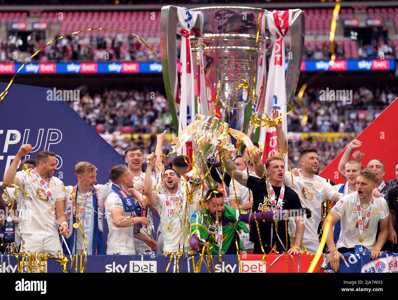 Port Vale's Tom Pett lifts the trophy as they celebrate winning the Sky ...