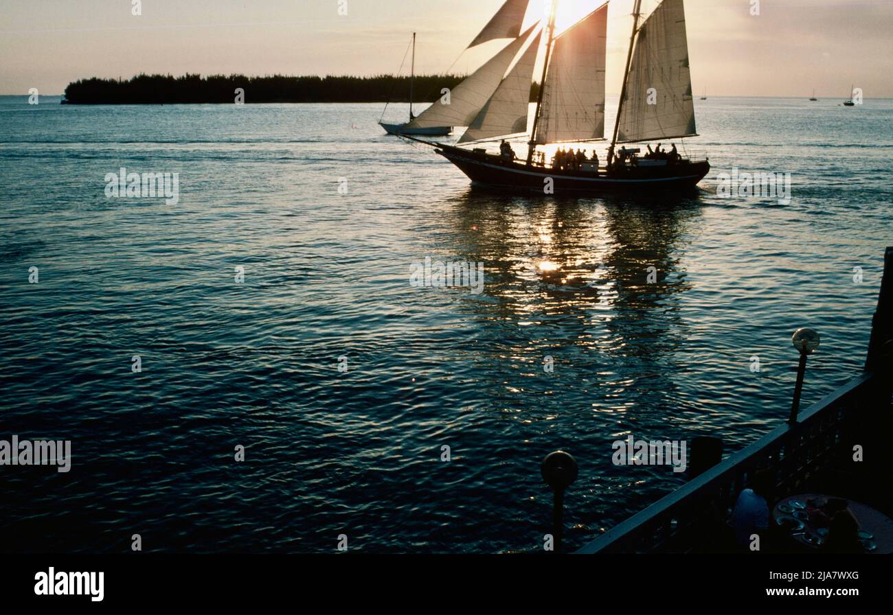 Sailing ship in sunset passing Key West, Florida, the southernmost ...