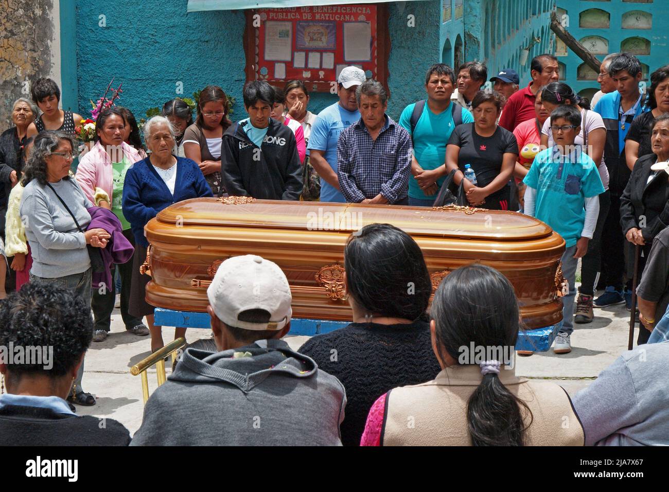 coffin and mourners in a typical burial ceremony in the Matucana ...