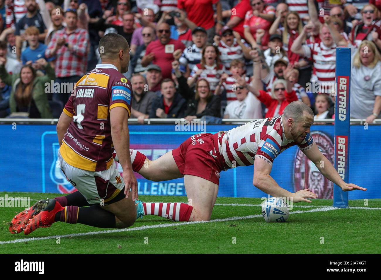 Liam Marshall #5 of Wigan Warriors goes over for the winning try and ...
