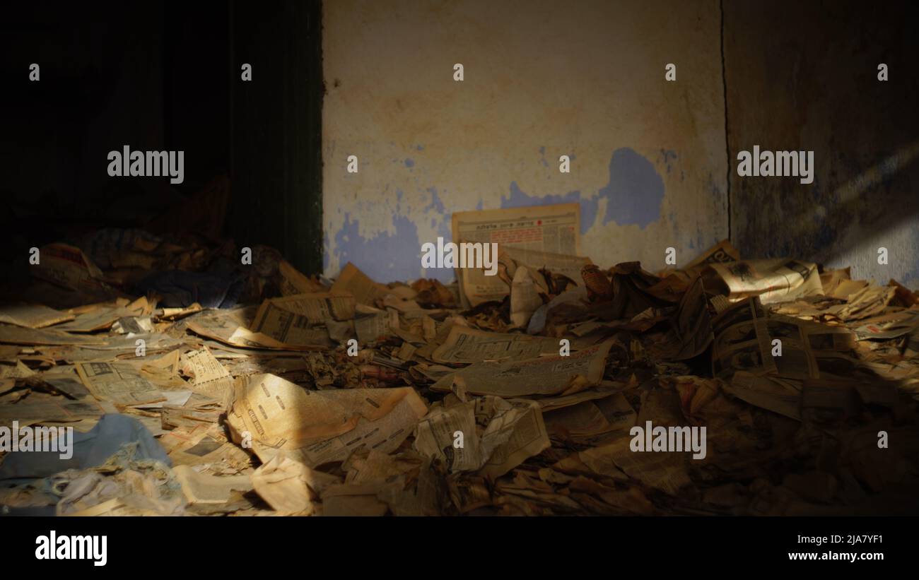 An old abandoned building with old newspapers on the floor Stock Photo ...