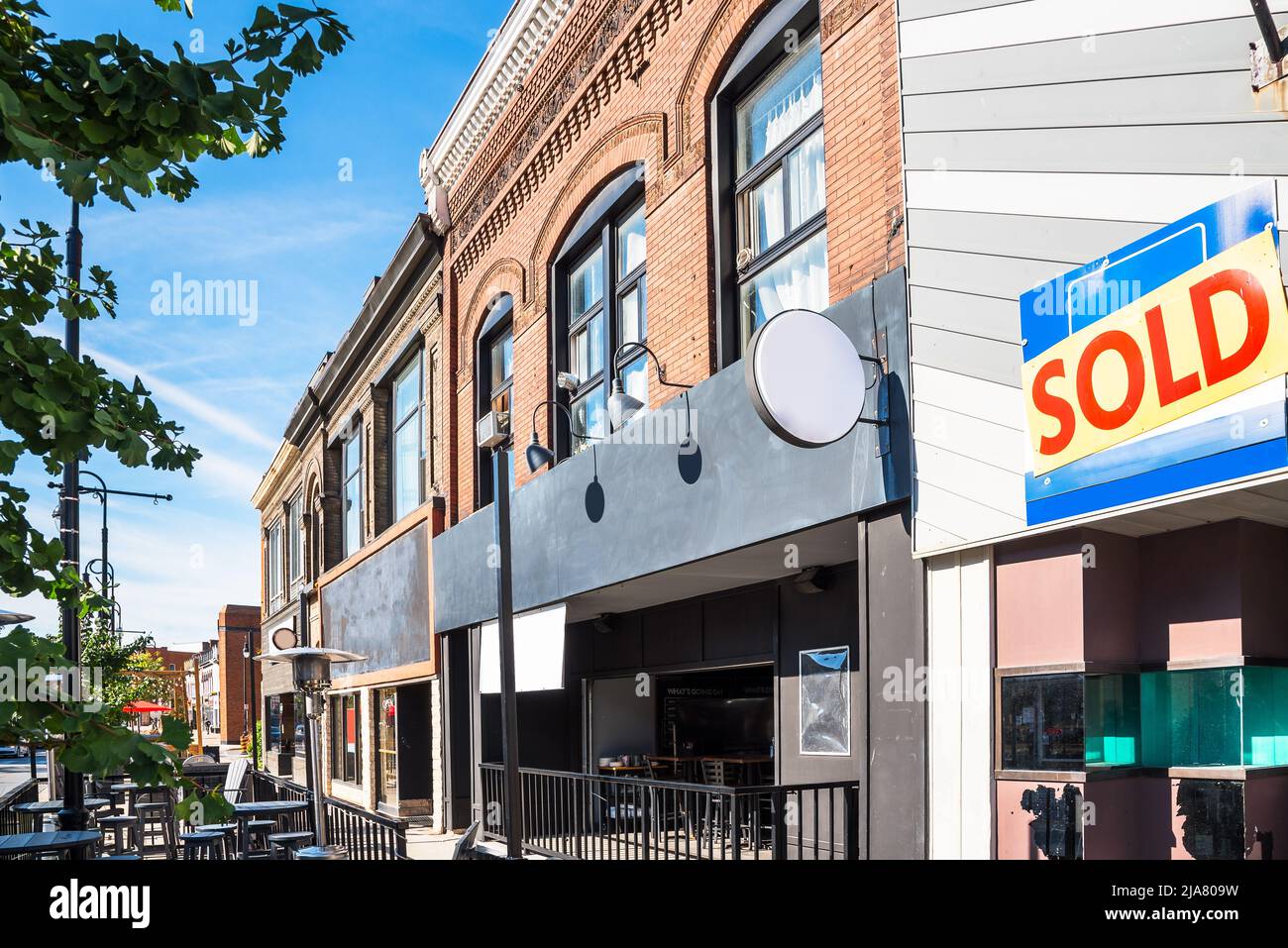 Traditional American brick buildings with restaurants and shops on the ...