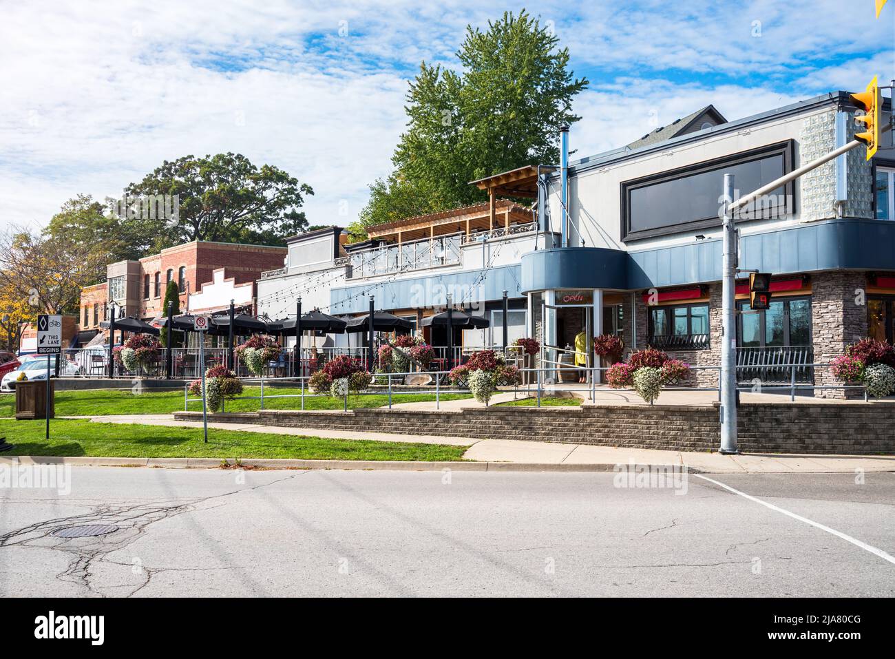 Traditional architecture and restaurants with outdoor tables in a city ...