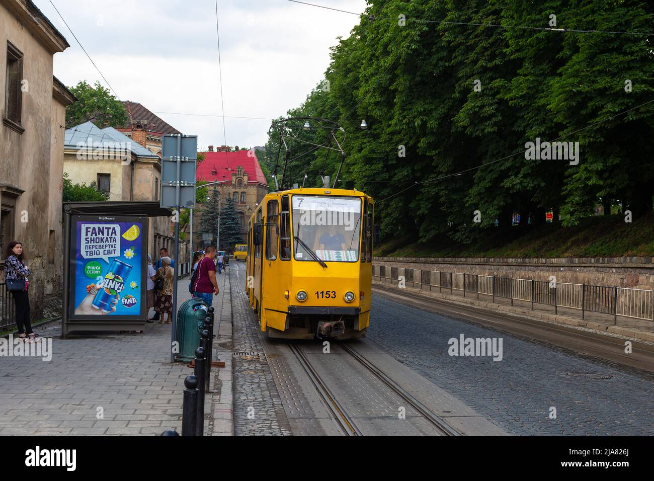 Lviv, Ukraine 08 June 2018: Modern, yellow tram at the stop. Historical ...