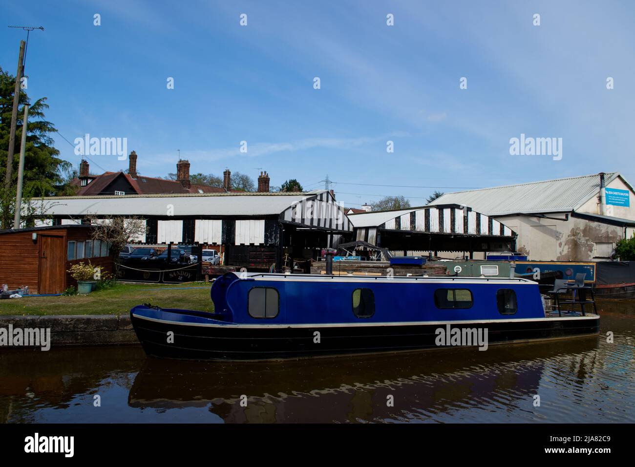 Traditional scene with a blue barge on the Bridgewater canal in Worsley ...