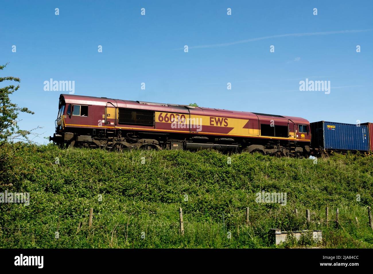 An EWS class 66 diesel locomotive No. 66030 pulling a freightliner ...