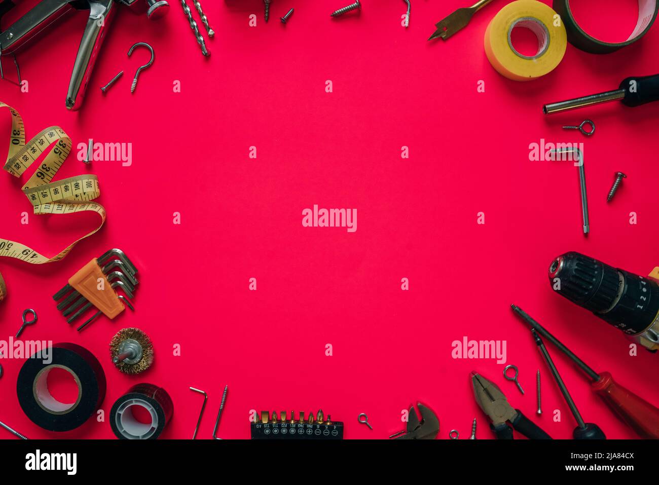 construction tools on a pink background Stock Photo - Alamy
