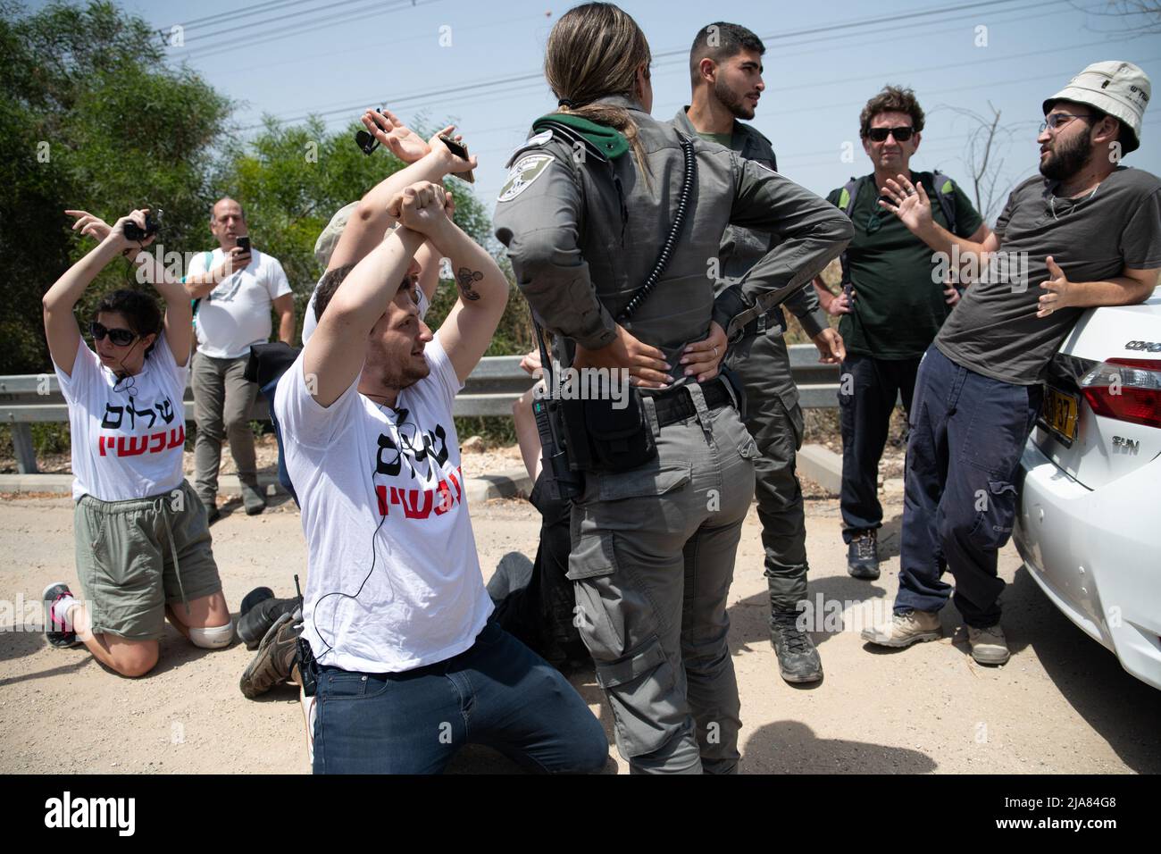 Peace activists block a police vehicle with the arrested D9 driver ...
