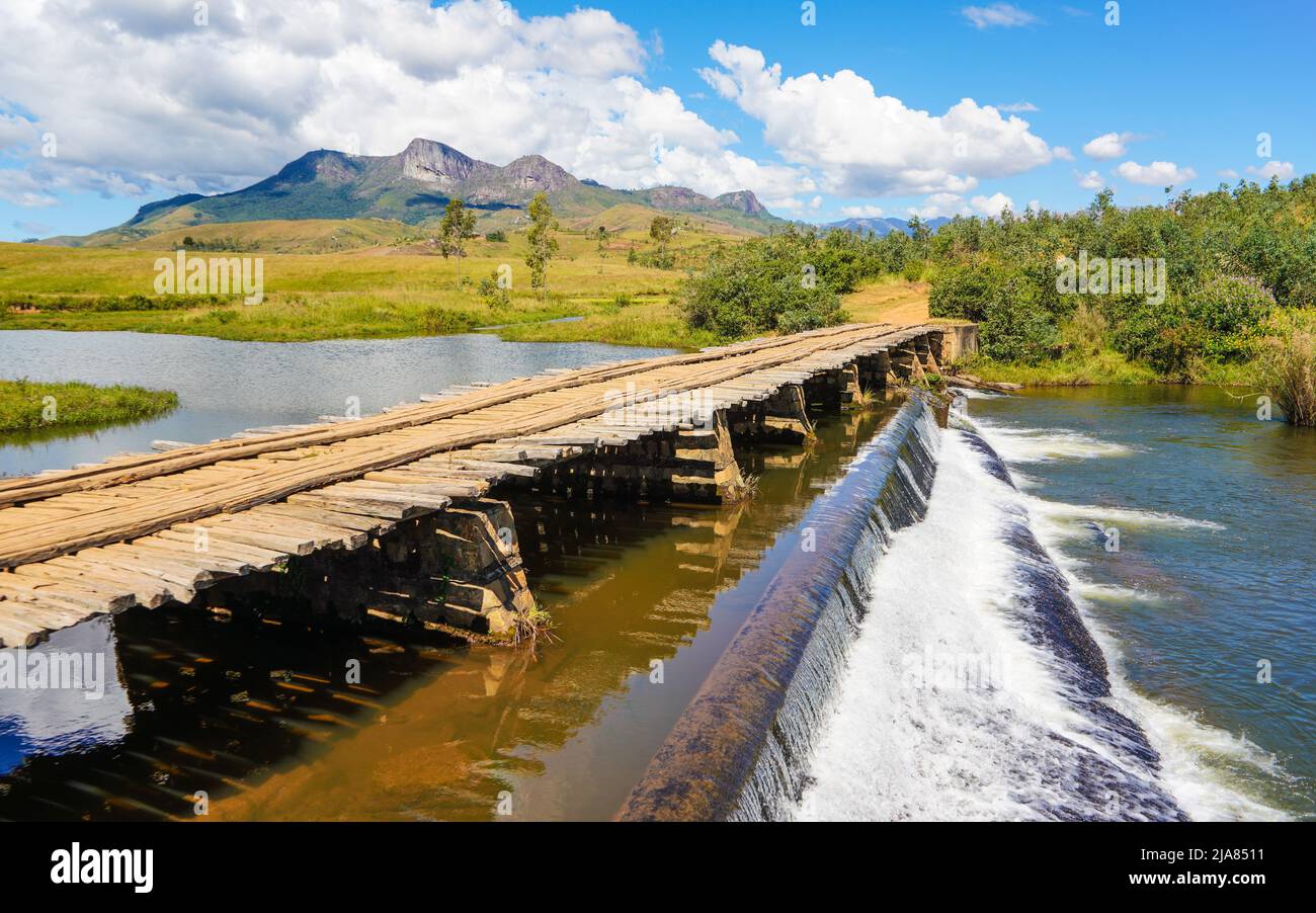 River flowing under wooden bridge near Sendrisoa as seen during trek to ...