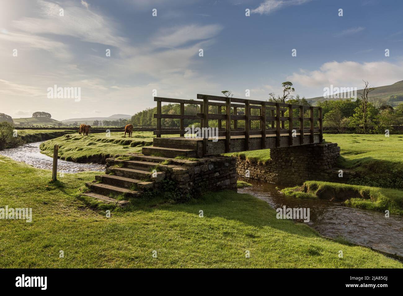 Footbridge over Gayle Beck near the picturesque market town of Hawes in ...