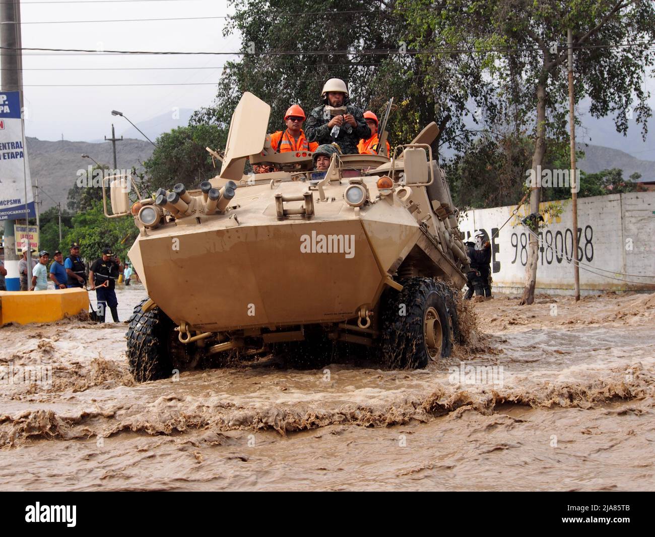 Peruvian Marines, using amphibious vehicles (ASLAV-II), rescue victims ...