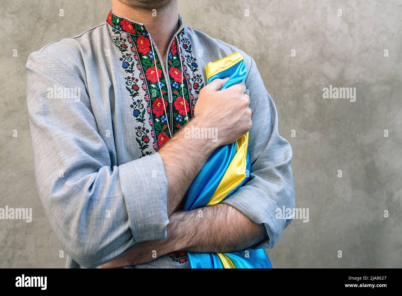 Soft Selective focus Man holds the blue and yellow national flag of ...