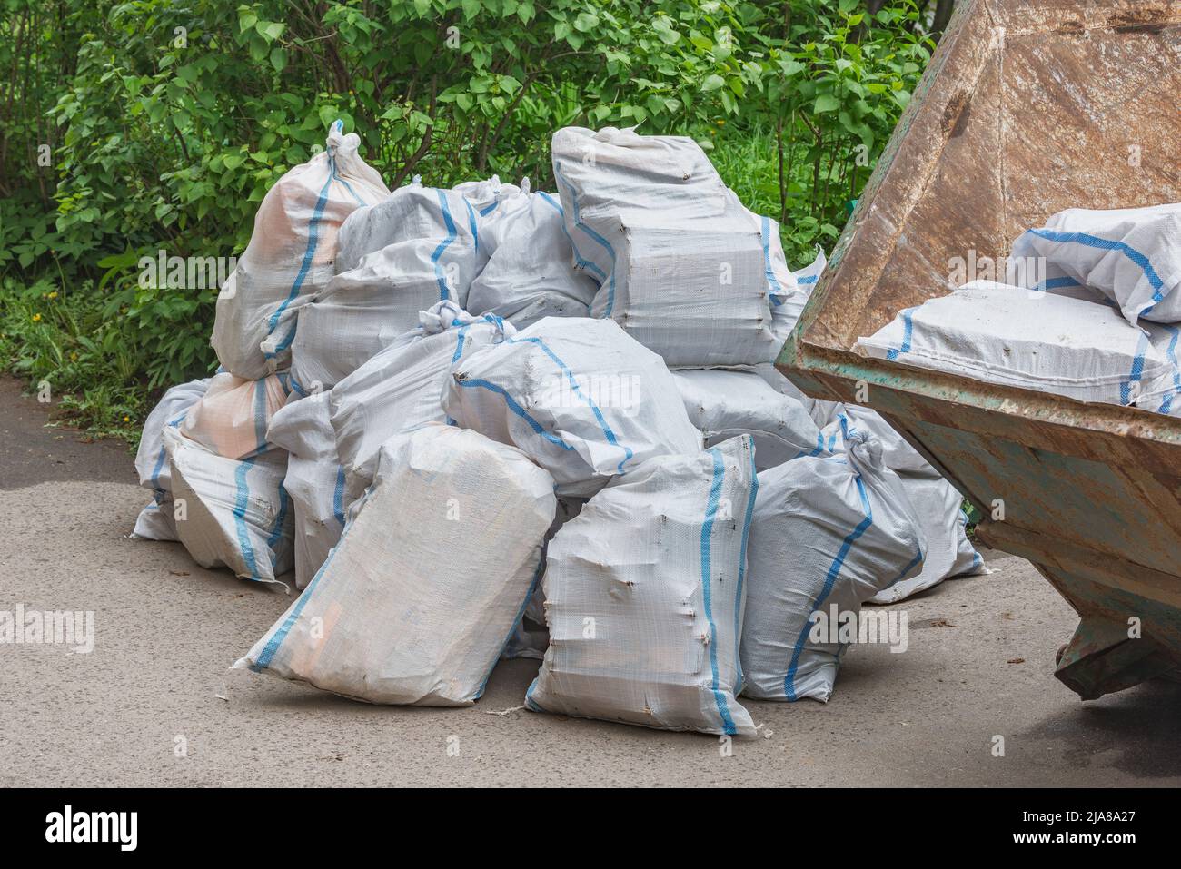 Construction waste in the bags before loading Stock Photo - Alamy
