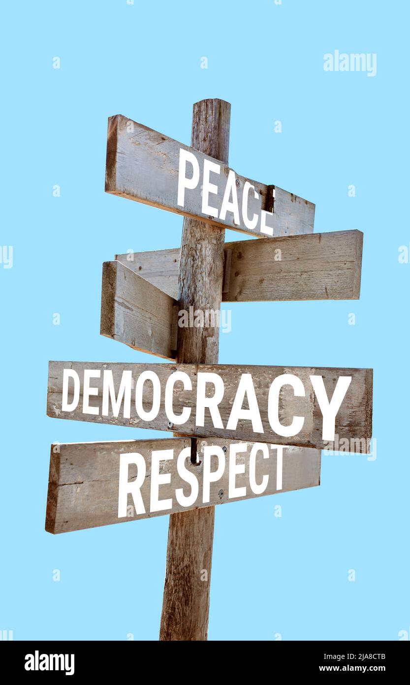 Wooden road sign with words peace, democracy, respect Stock Photo - Alamy