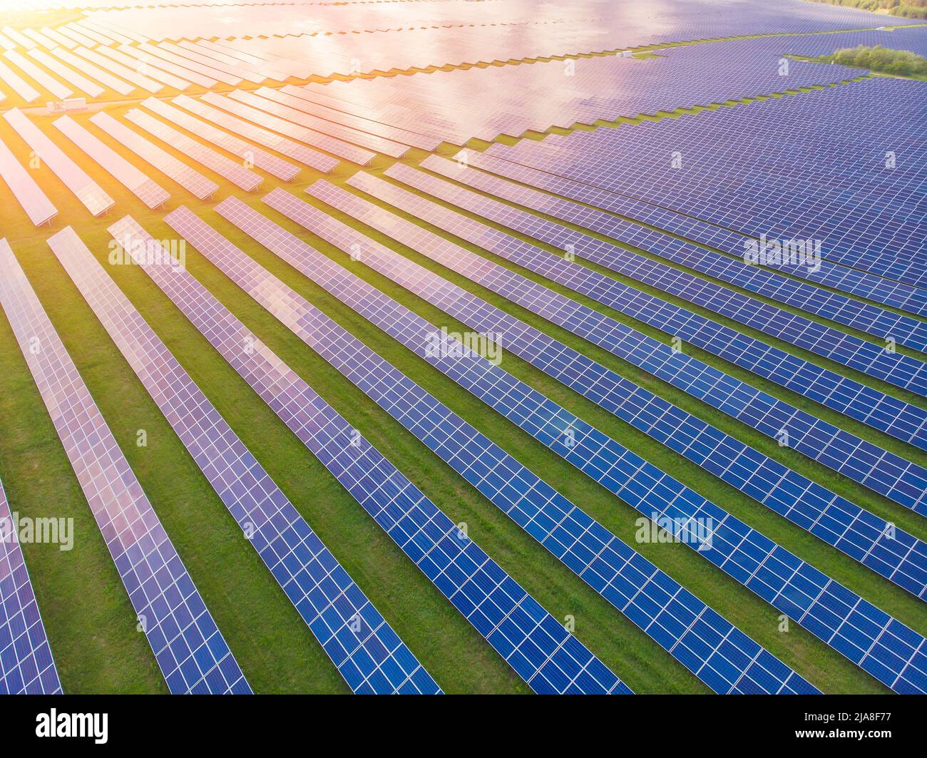Drone aerial view of a photovoltaic solar system. Metallic blue solar ...