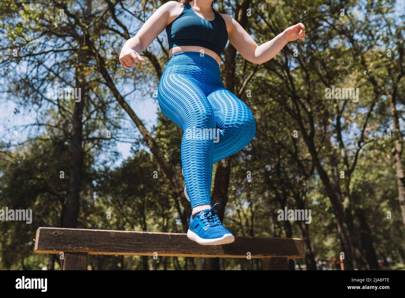 croppet shot of a beautiful young fitness girl, training outdoor ...