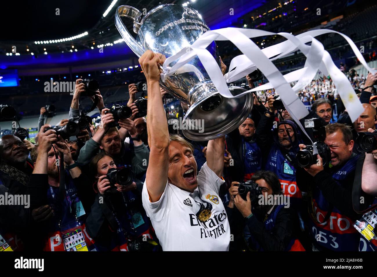 Real Madrid's Luka Modric celebrates with the trophy after winning the ...