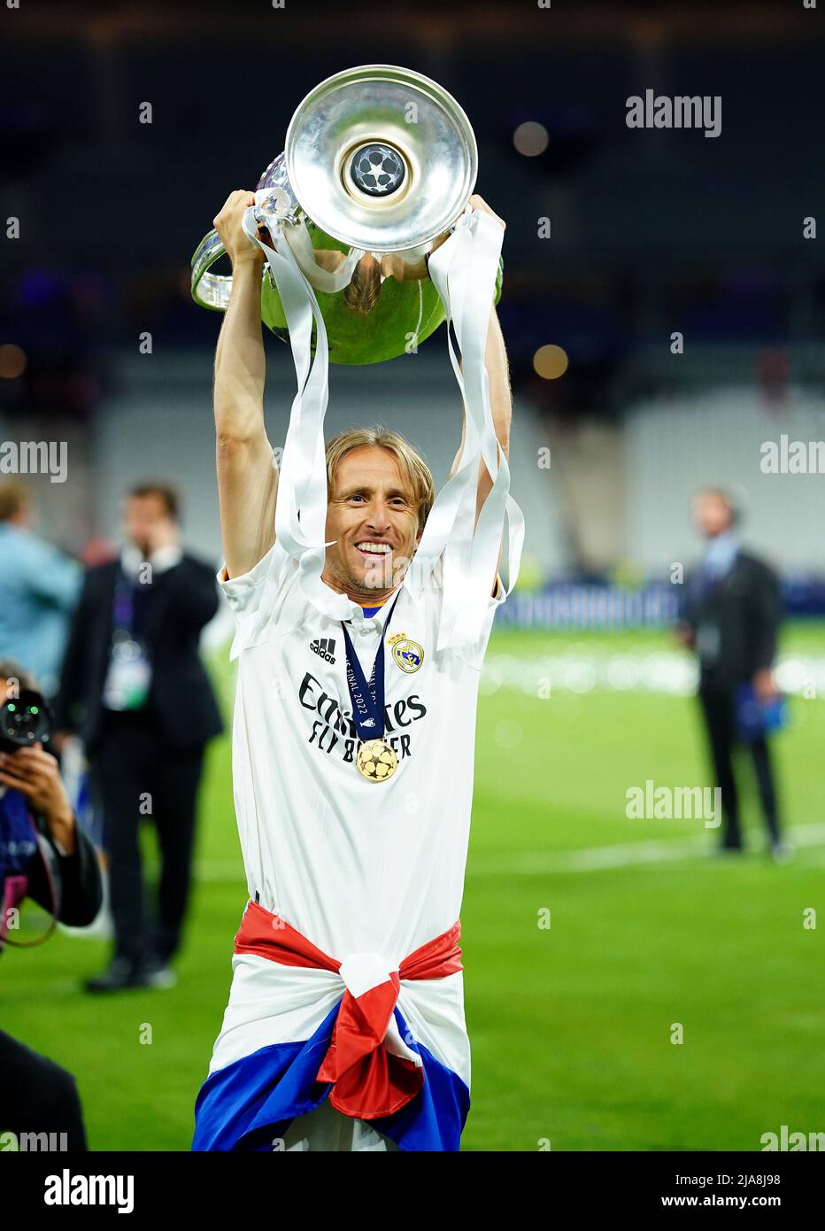 Real Madrid's Luka Modric celebrates with the trophy after winning the ...