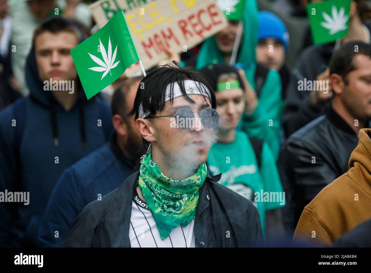 A man smokes in a crowd during the Marijuana liberation march in the ...