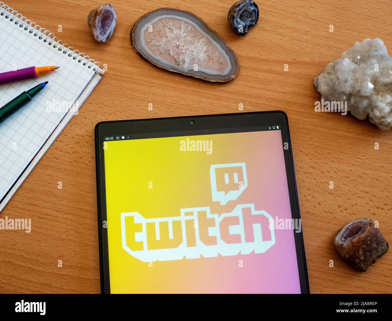 In this photo illustration Twitch logo seen displayed on a tablet Stock ...