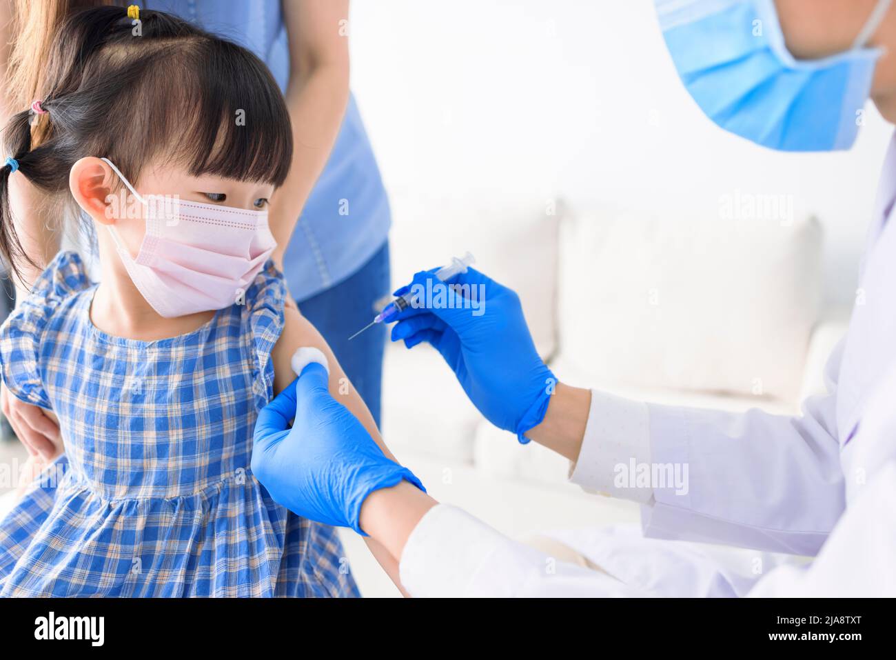 Medical Doctor injecting child with vaccine at clinic or hospital Stock ...