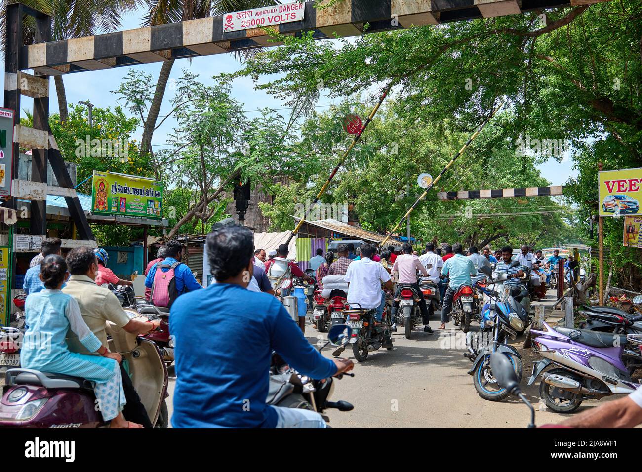 Indian people crowd on road traffic near railway gate Stock Photo - Alamy