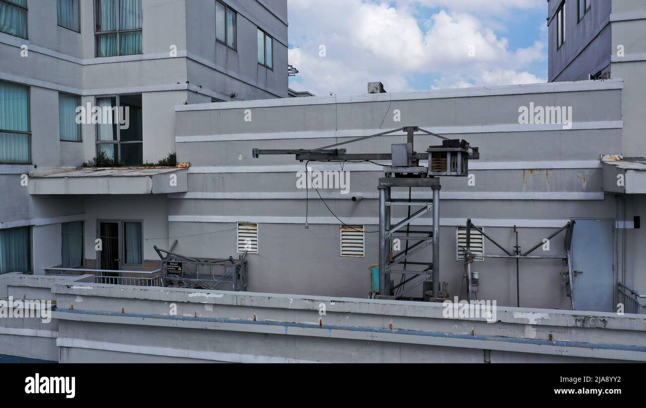Building facade maintenance system. On the roof. Crane for cleaning ...