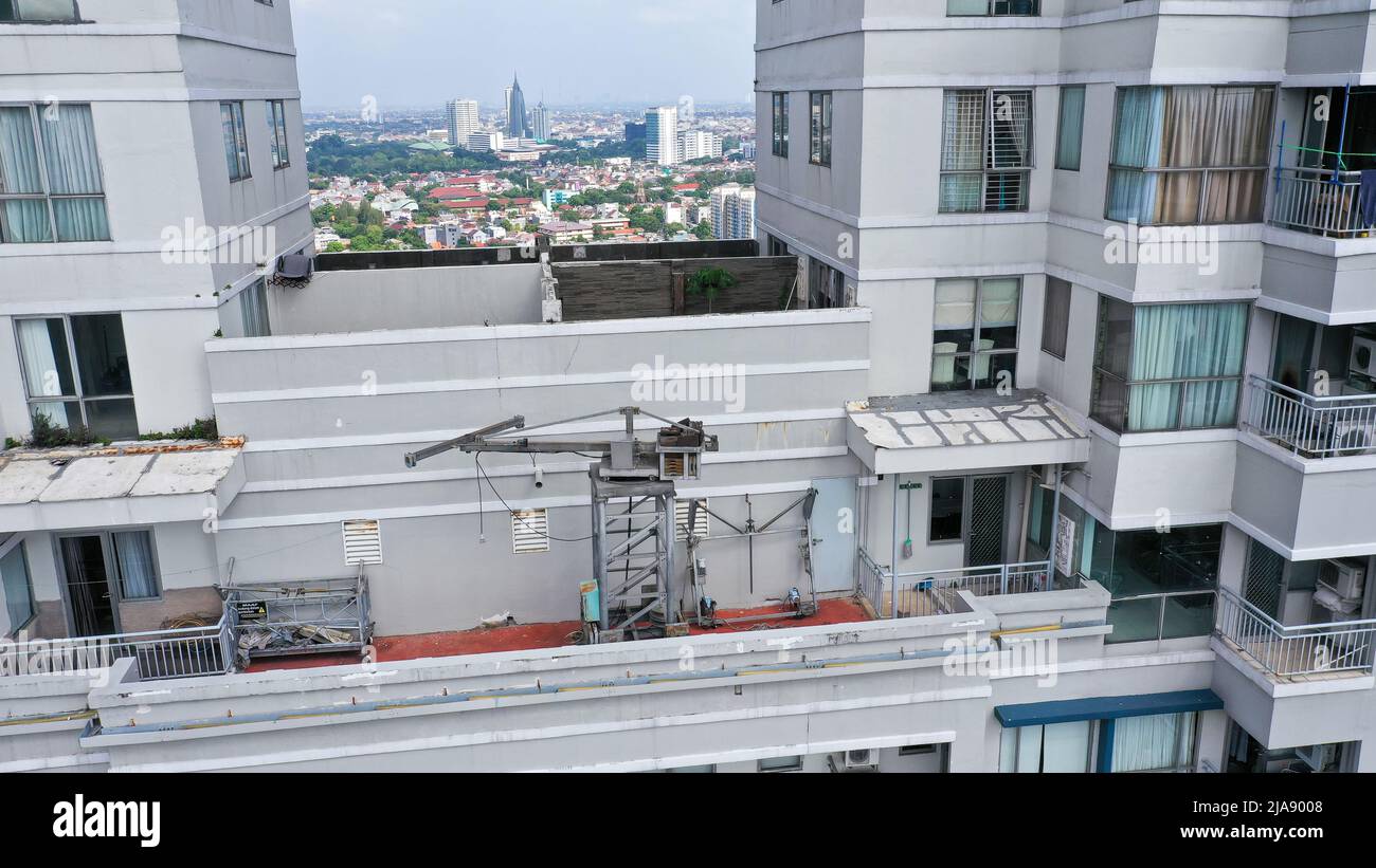 Building facade maintenance system. On the roof. Crane for cleaning ...