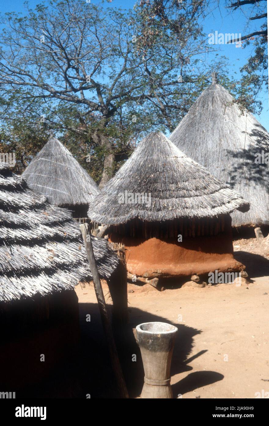Rural village with grain stores, Zimbabwe, 1984 Stock Photo - Alamy