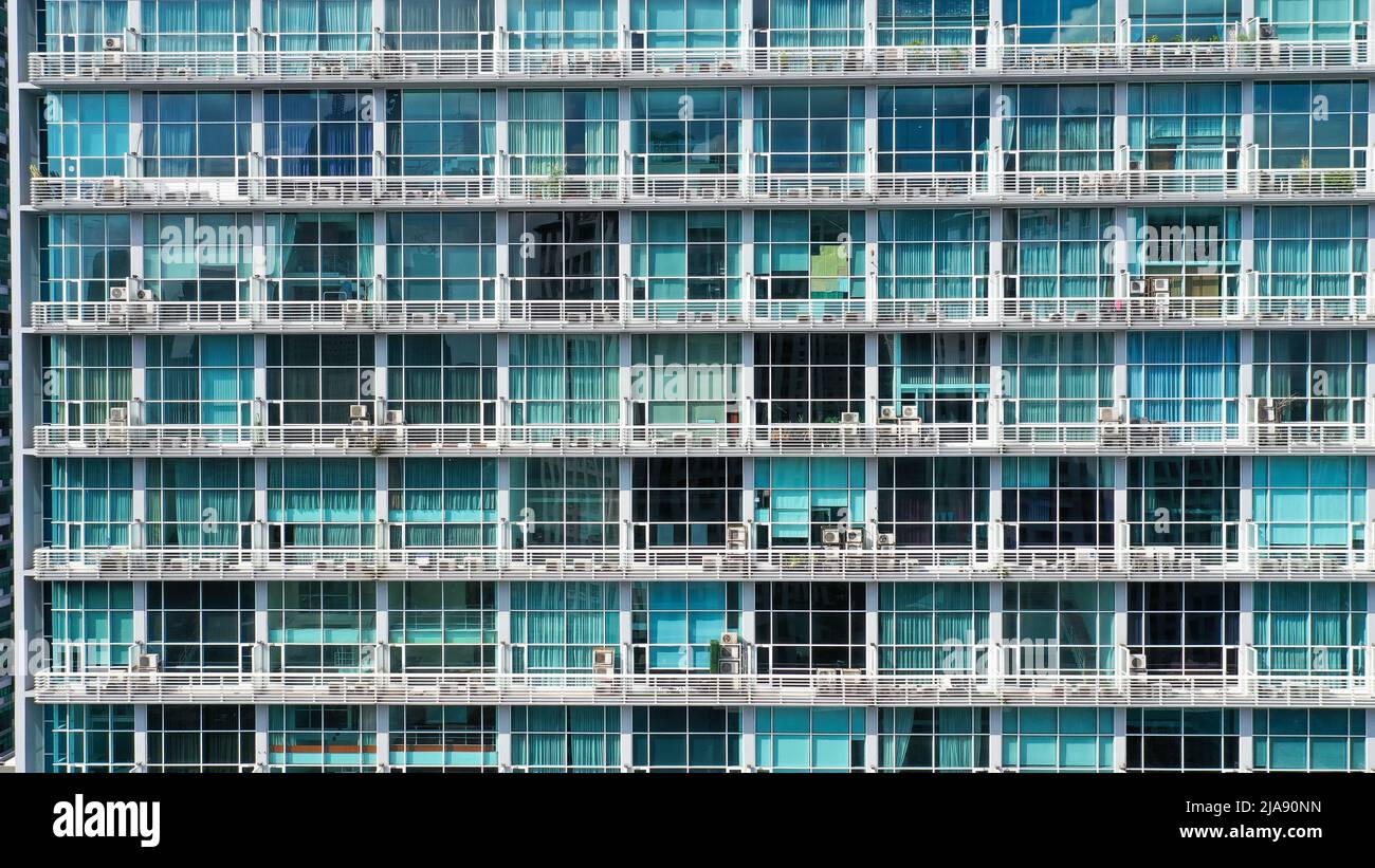 Glass grey square Windows of modern city business building skyscraper ...