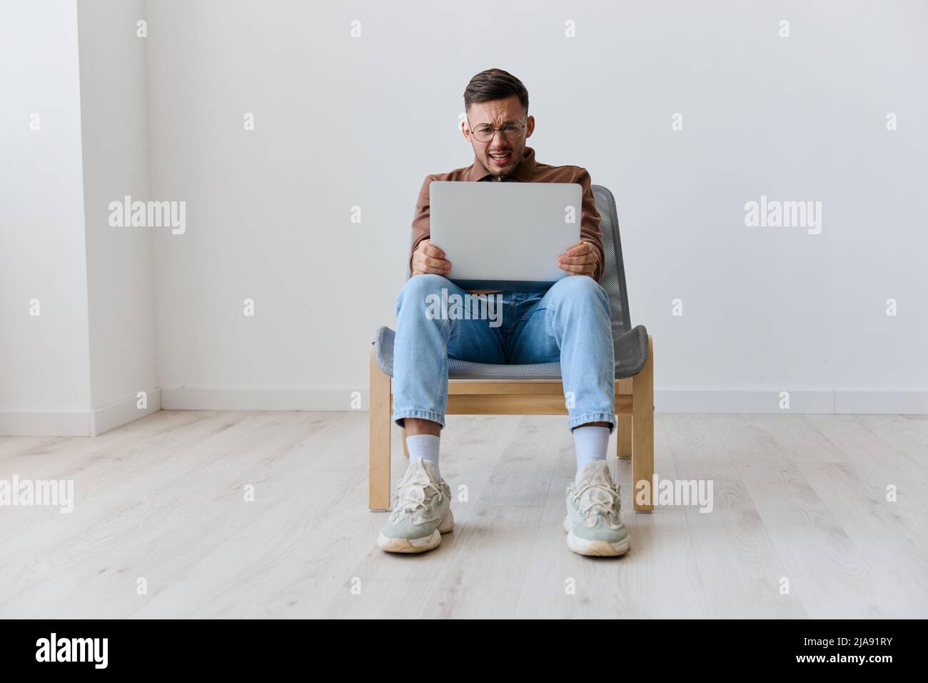 Sad teacher sitting on desk hi-res stock photography and images - Alamy
