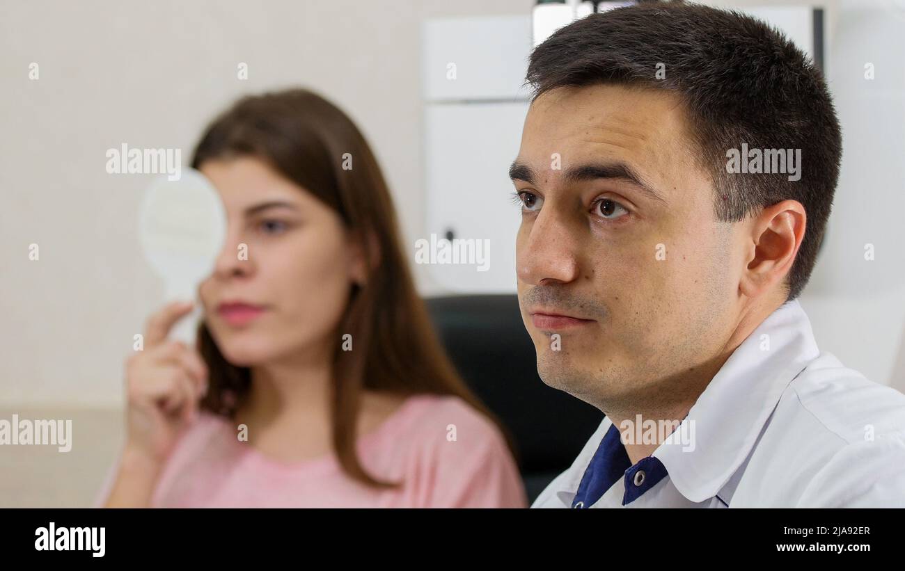 Ophthalmology treatment - young woman checking her visual acuity ...